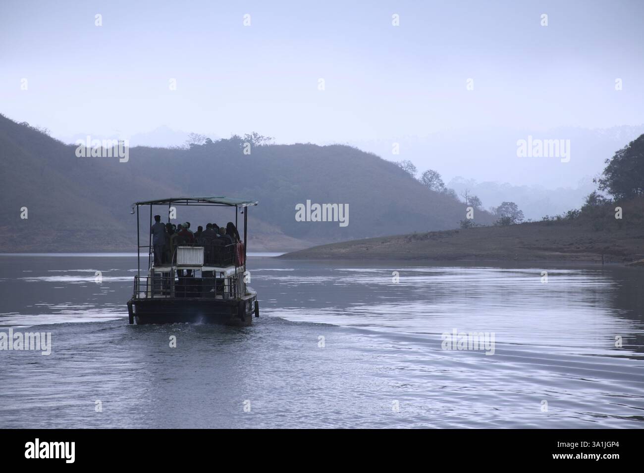 Early morning landscape of Periyar lake tourists on boat ride at ...