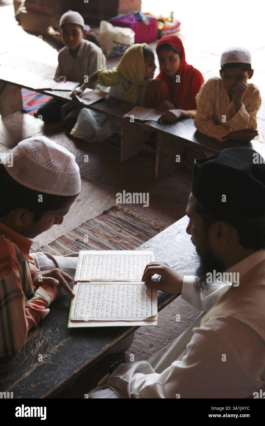 Muslim teacher and students in Urdu Muslim School classroom Madarasa in ...