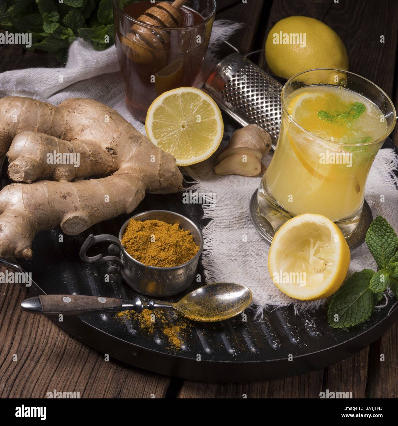 Lemon- ginger lemonade with honey Stock Photo - Alamy