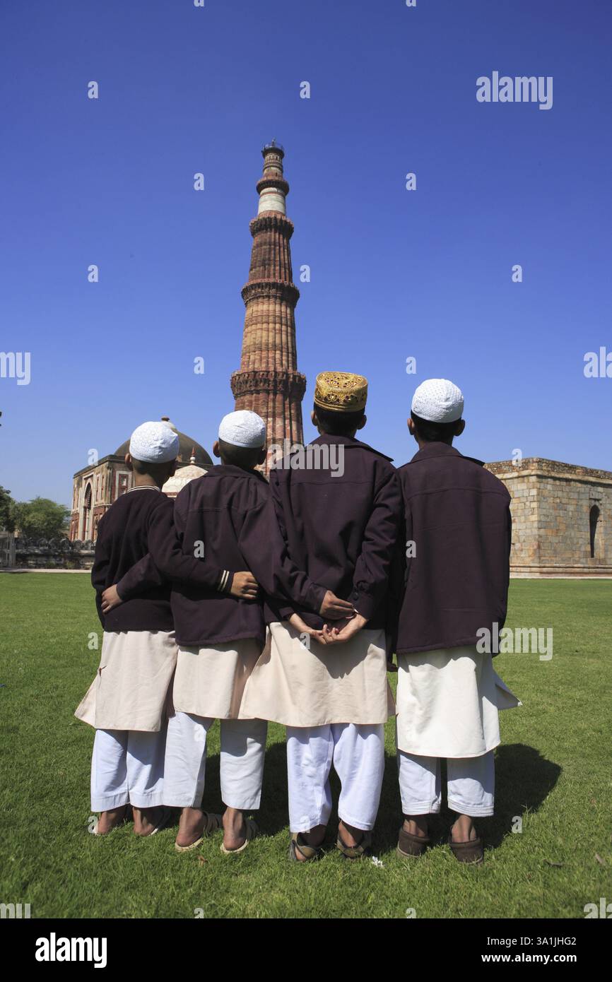Children doing religious prayer Namaz in front of Qutab Minar built in ...