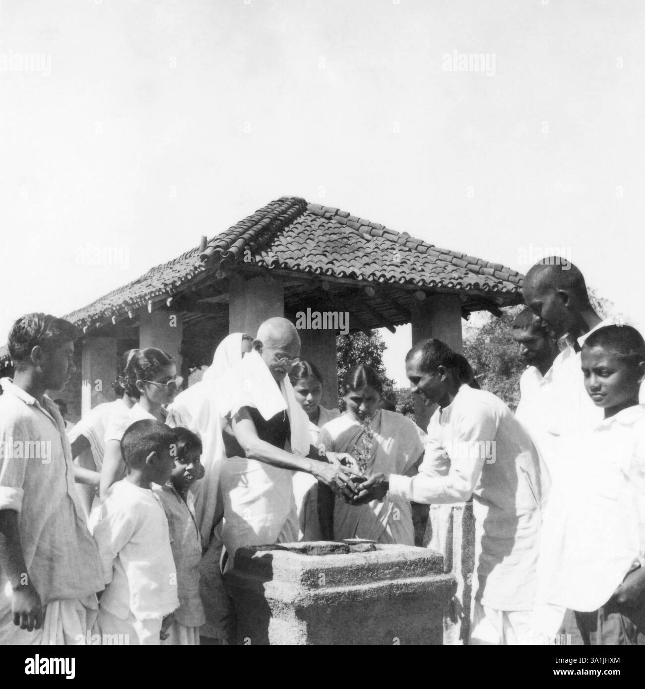 Mahatma Gandhi, Durga Mehta and others at a tulsi tree planting ...