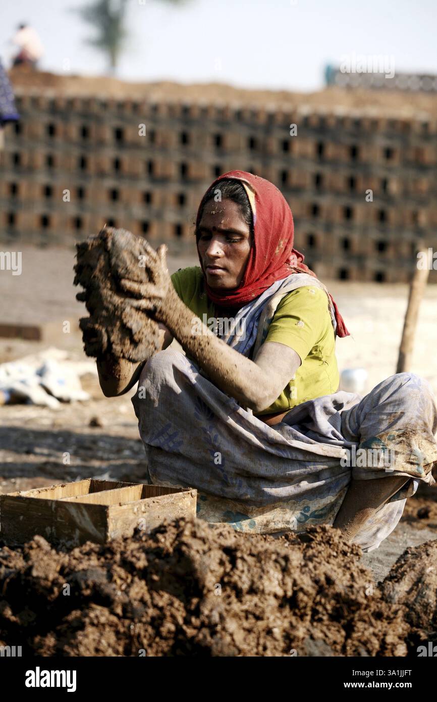 A woman brick maker at the brick factory in a village of Sangli ...
