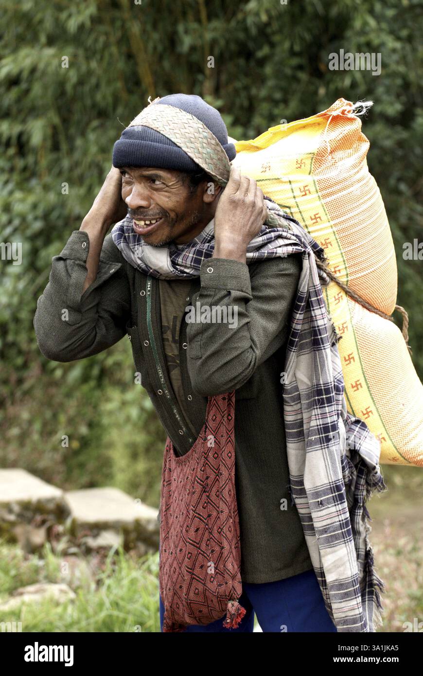 Rural man carrying load on his back, the Khasi tribe, Shillong ...