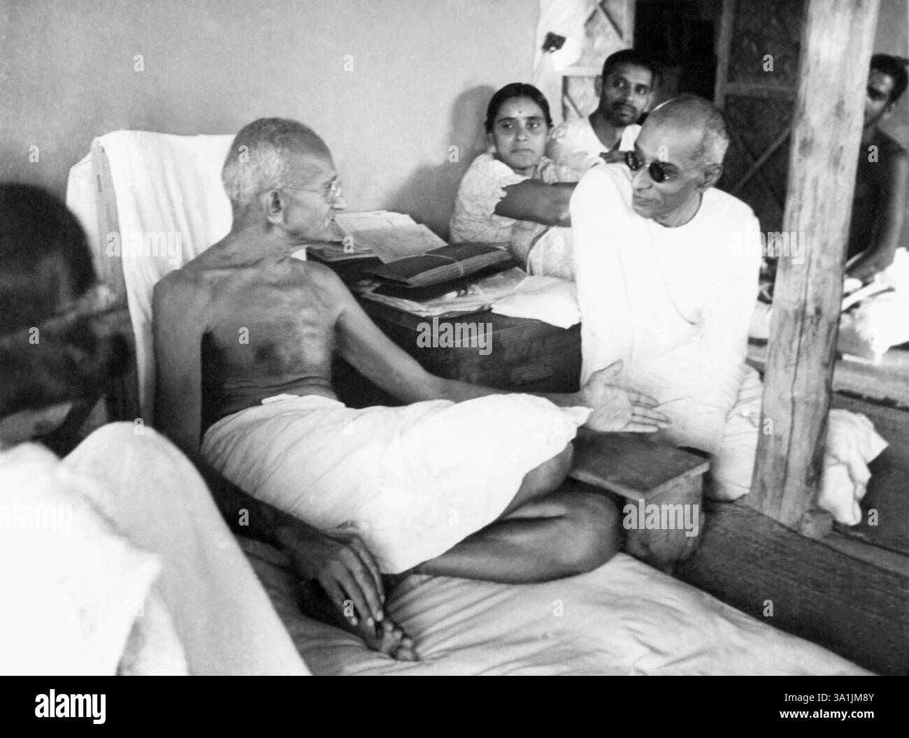 Mahatma Gandhi talking with Chakravarti Rajagopalachari in his hut at ...