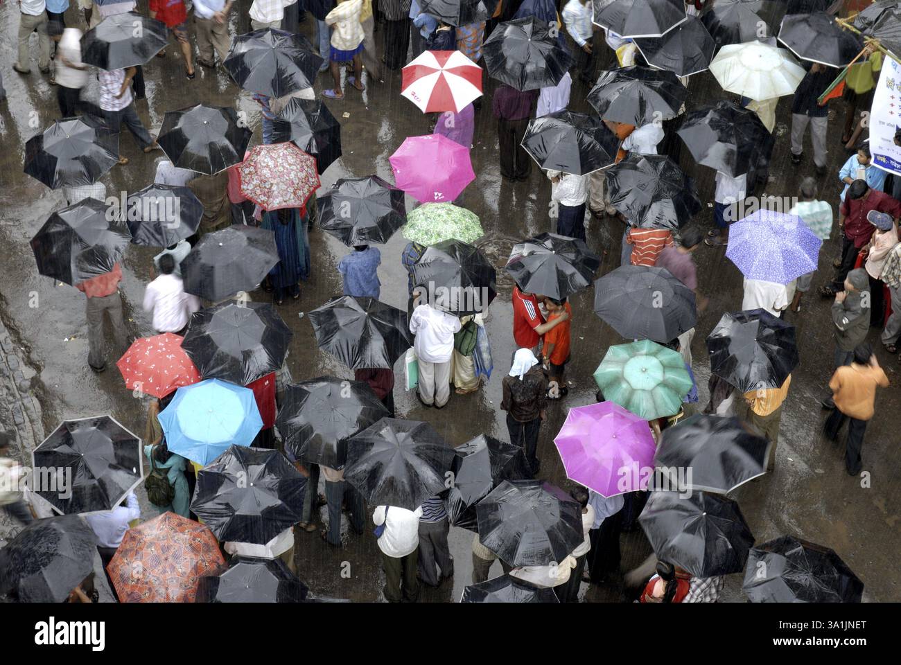 Aerial view of people using colorful umbrellas near Dadar, Mumbai ...