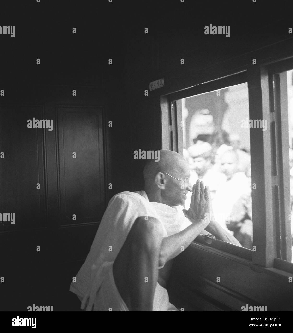 Mahatma Gandhi, greeting people through the window of a train, 1940 NA ...