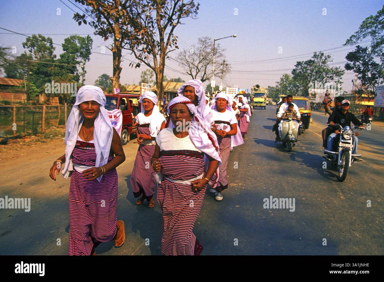 Women running on road at Imphal town, Imphal, Manipur, NArth East India ...