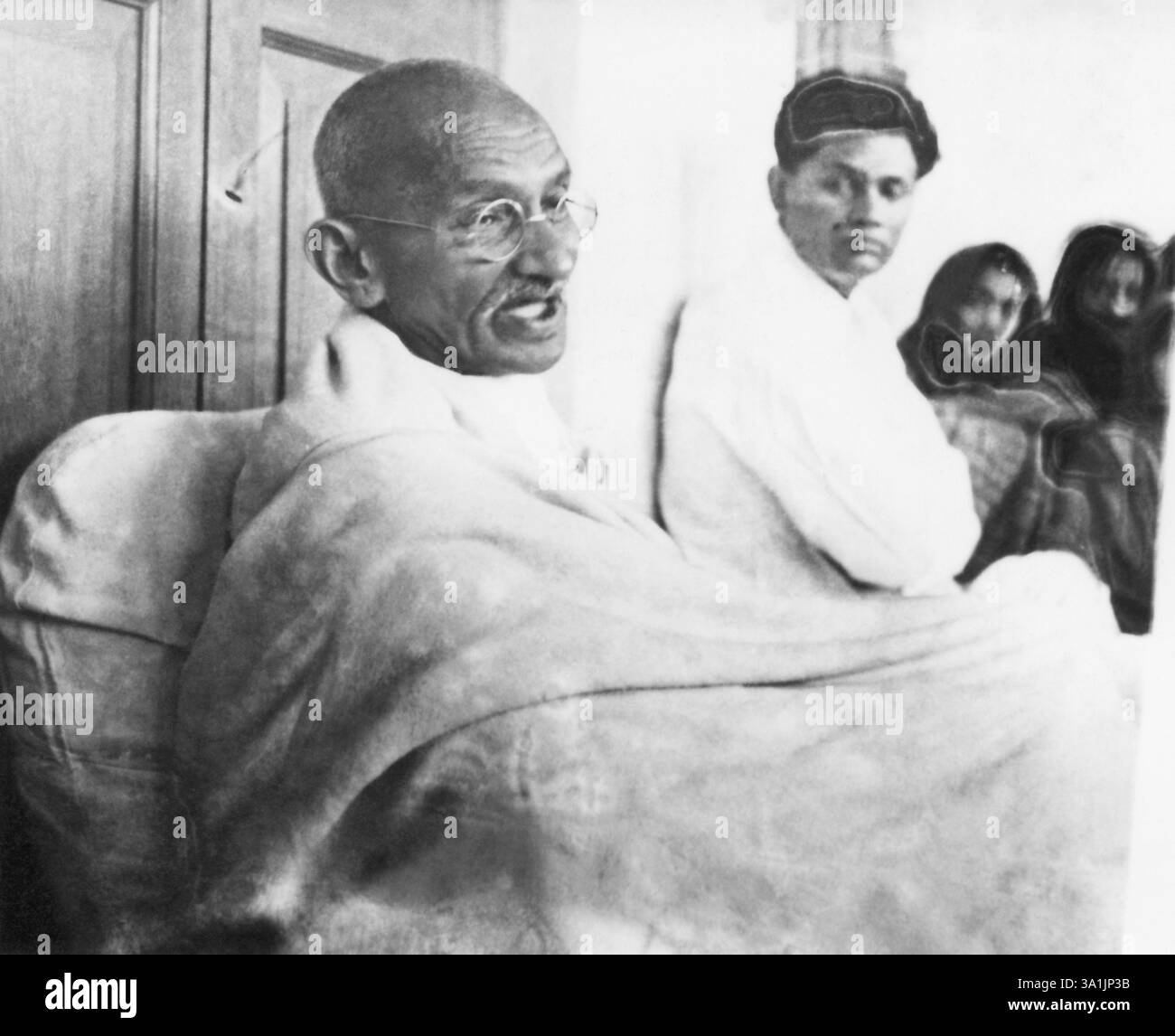 Mahatma Gandhi talking to workers during his fast at Rashtriyashala ...