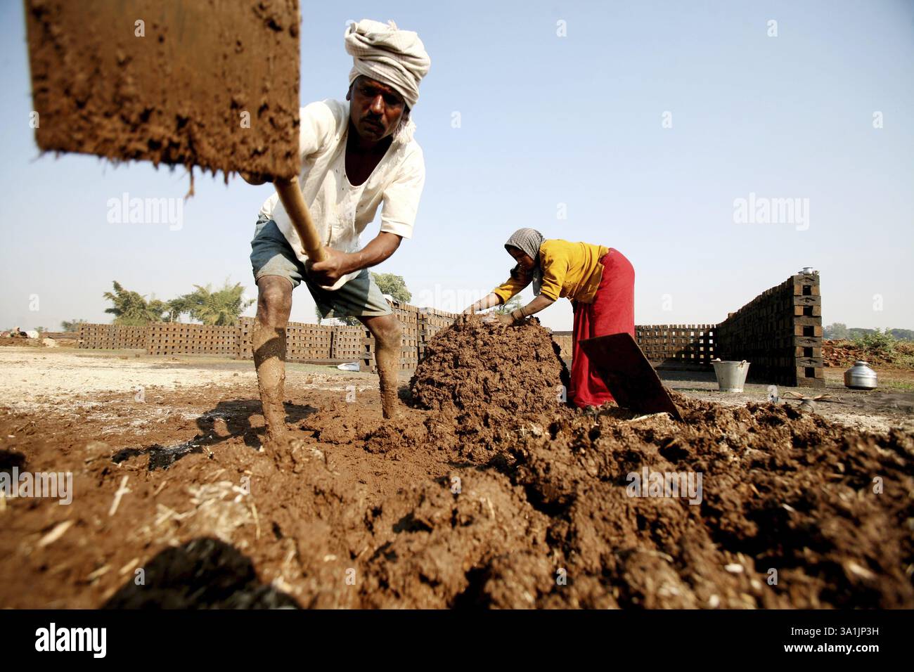 Workers including women at the brick factory in a village of Sangli ...