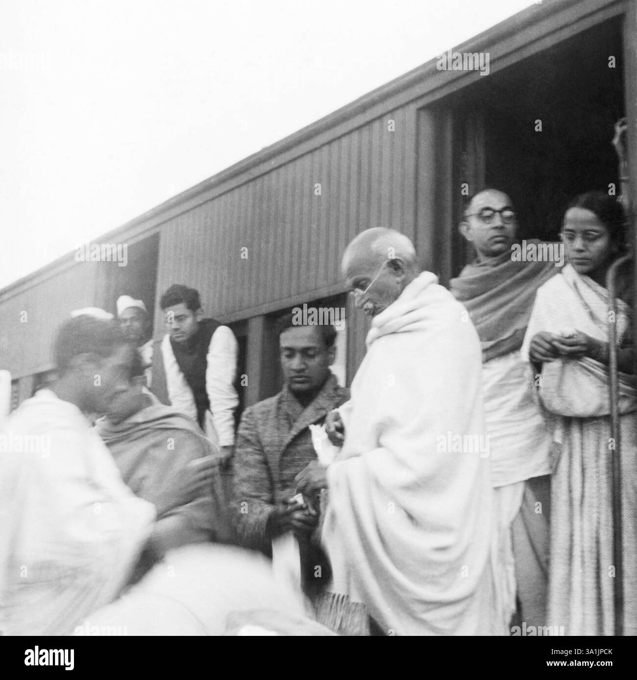 Mahatma Gandhi collecting donations for Harijan fund at a train station ...