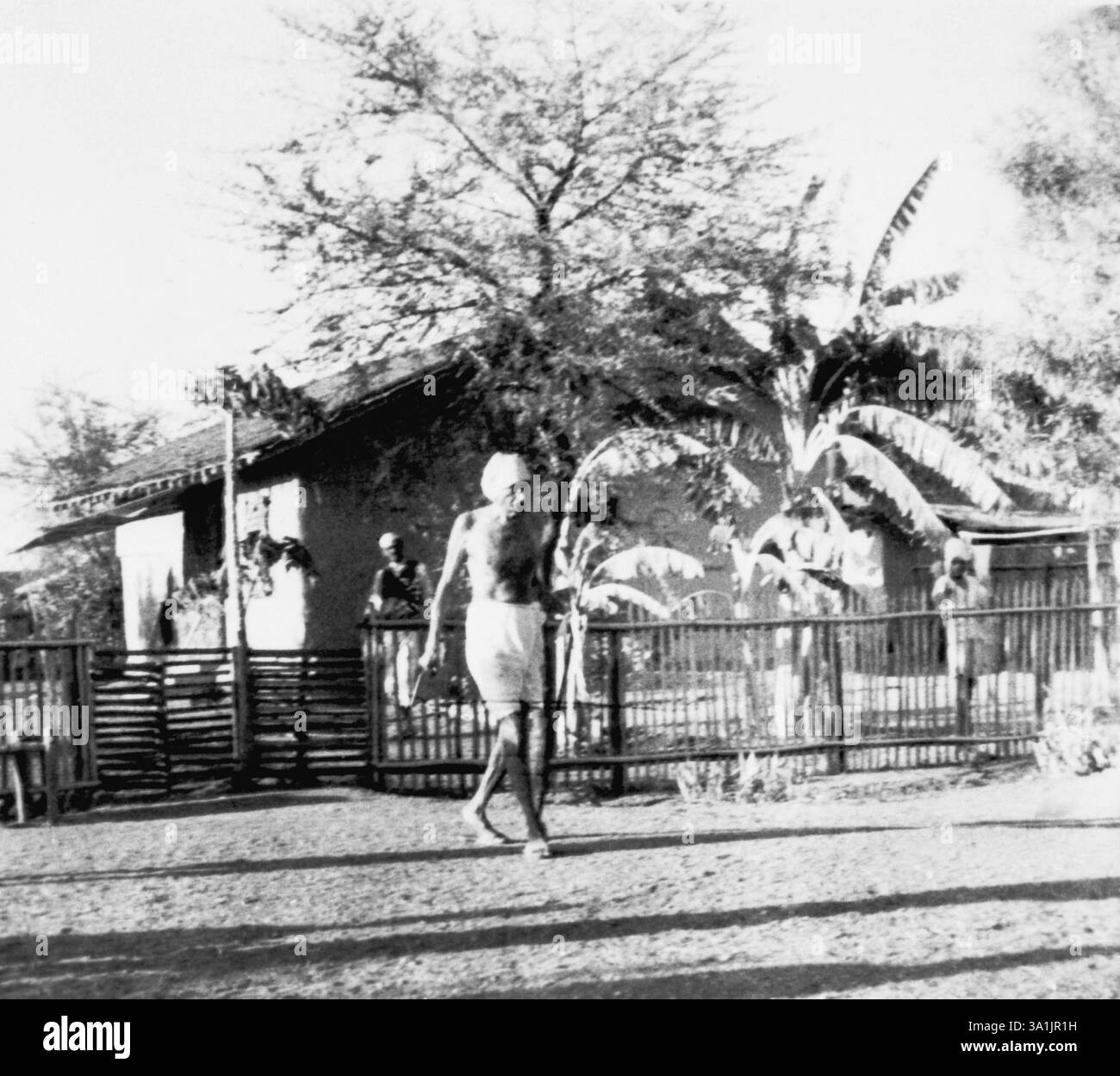 Mahatma Gandhi in front of his hut at Sevagram Ashram, 1940, Mahadev ...