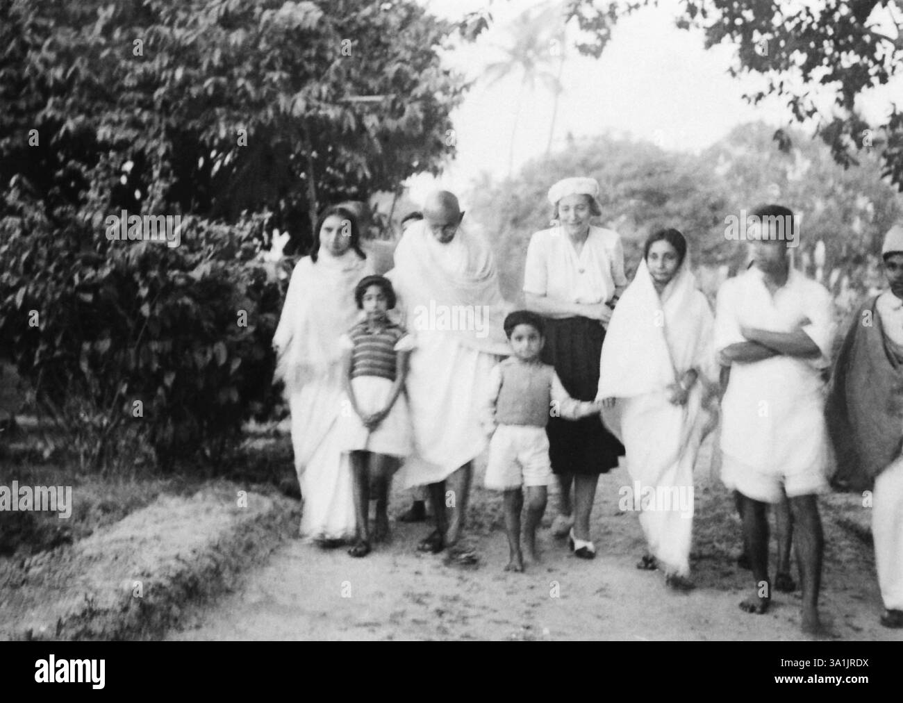 Sushila Nayar, Mahatma Gandhi and others walking at Khadi Pratishthan ...