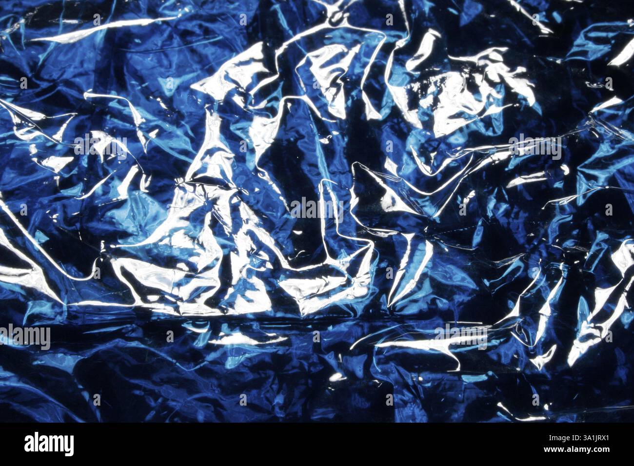 Abstract of blue cellophane paper Stock Photo - Alamy