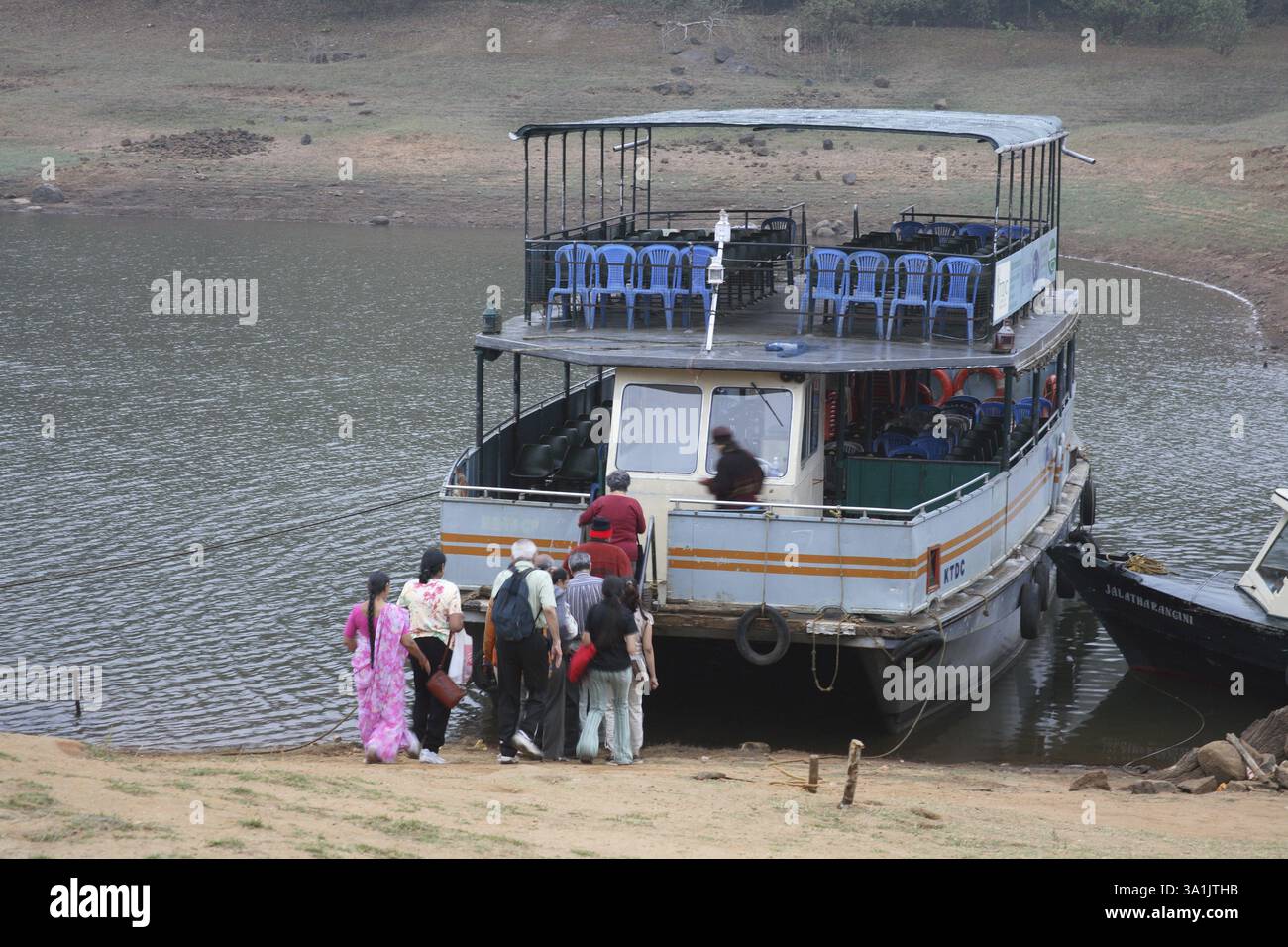Early morning tourists going toward boat Jetty for boat ride at Periyar ...