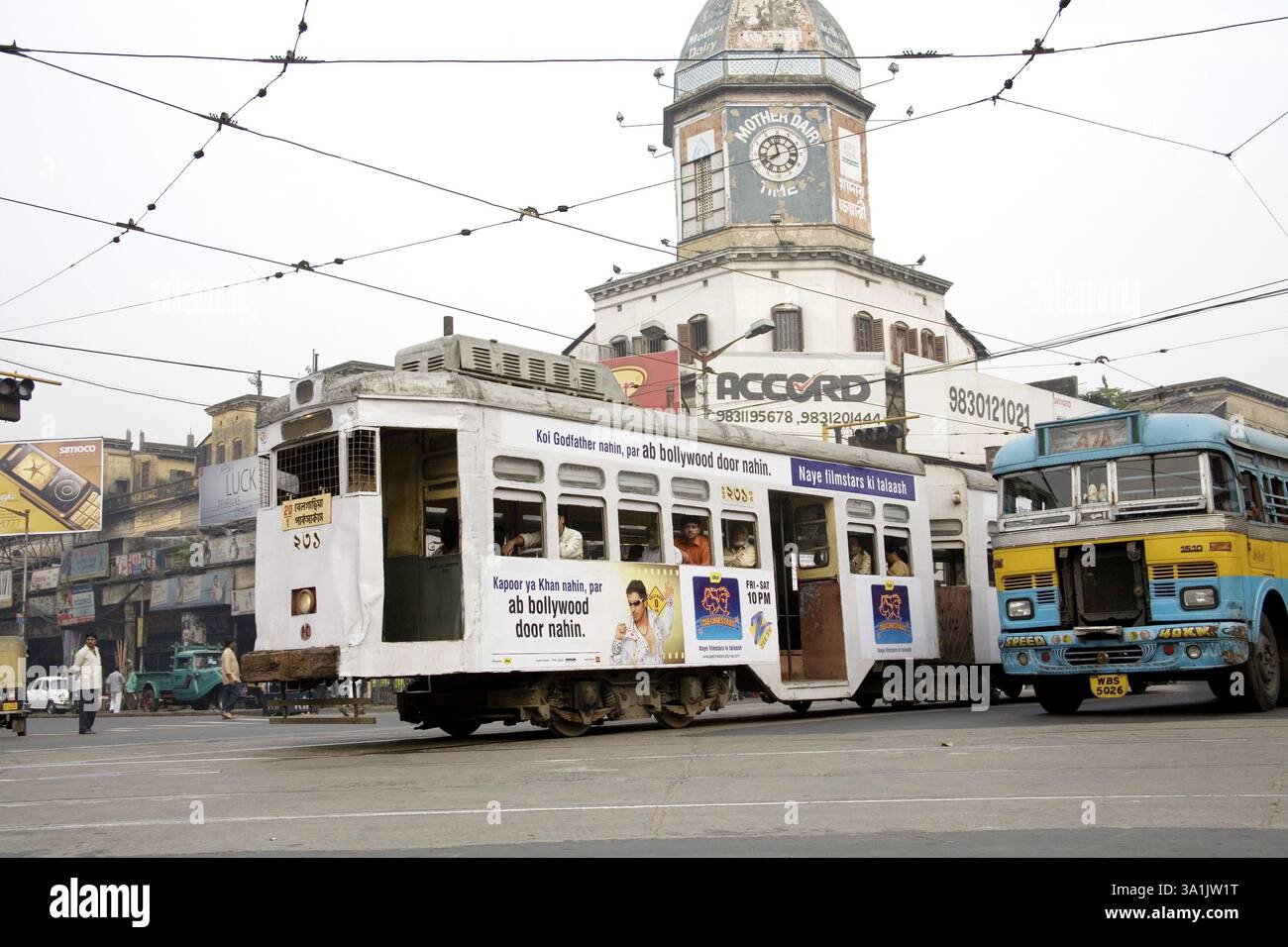 Street scene, tram and bus on road, Calcutta NAw Kolkata, West Bengal ...