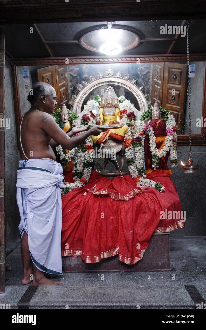 Shanmugar with consorts Valli and Deivanai Devasena inside temple ...