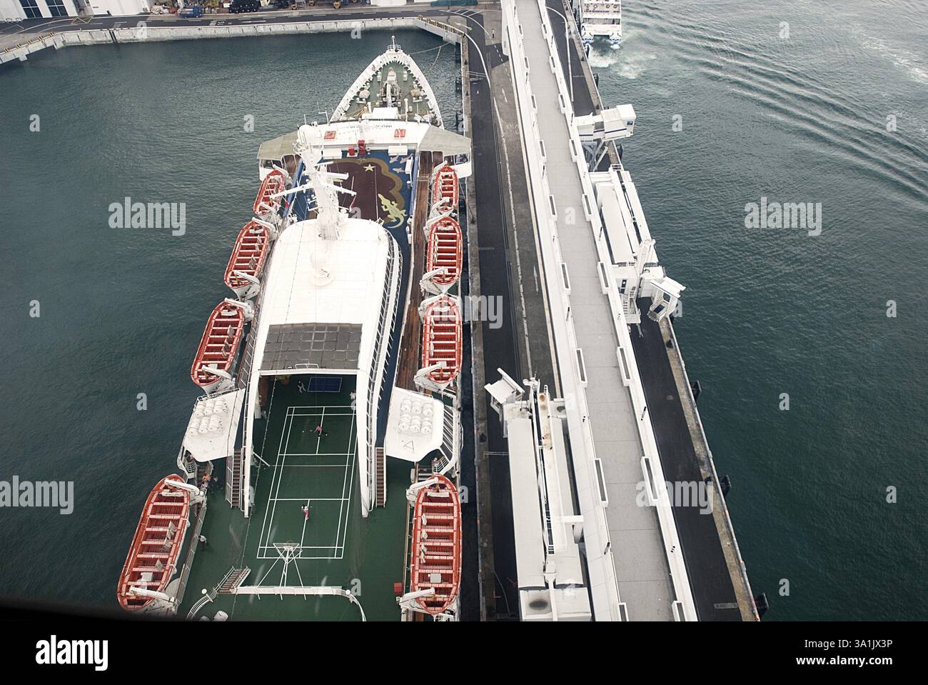 View of the boating dock area with two people playing badminton on a ...