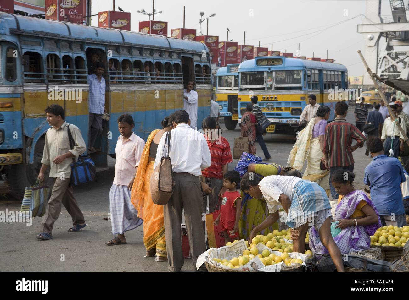 Street scene, local transportation buses and people in market, Calcutta ...