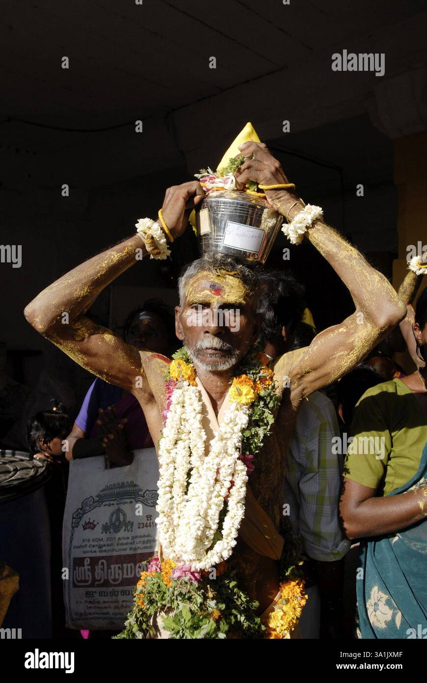Old man carrying milk pot Paal kudam on Vaikasi Visakam festival ...