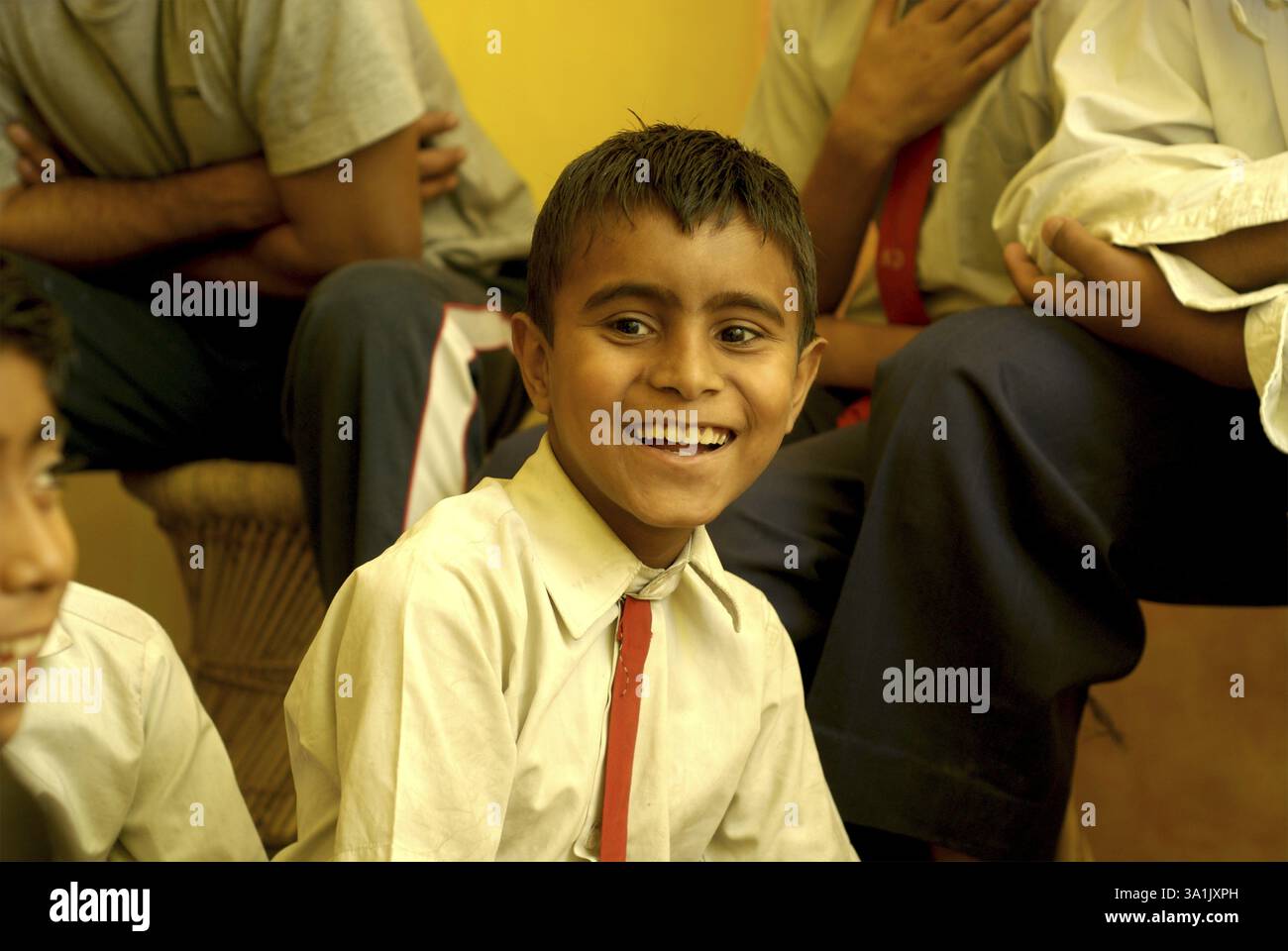 Boy smiling in the music room of Nanhi Dunya school, Dehradun ...