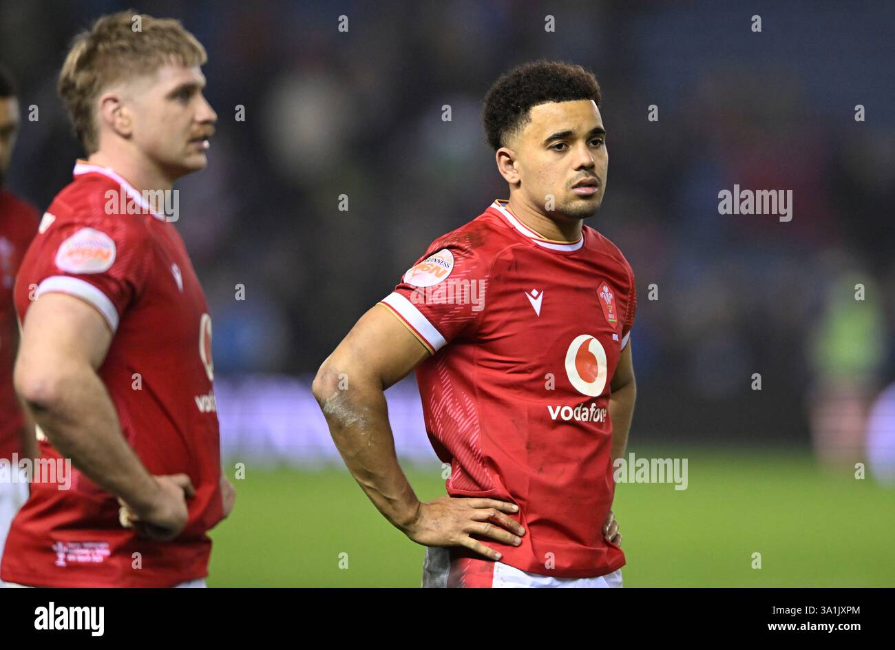 Edinburgh, UK. 8th Mar, 2025. Aaron Wainwright of Wales and Ben Thomas ...