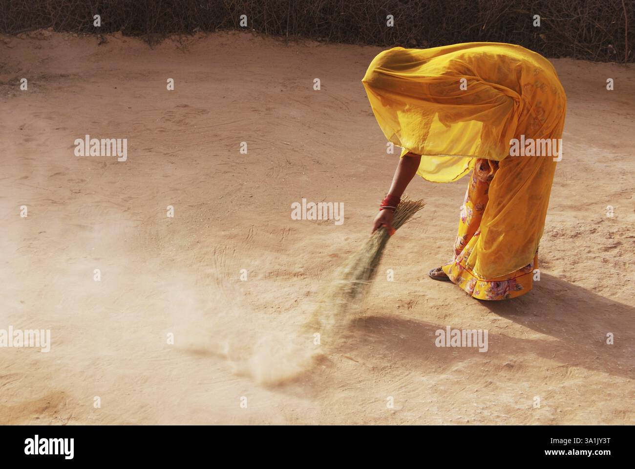 Lady sweeping dust by broom, India, Asia Stock Photo - Alamy