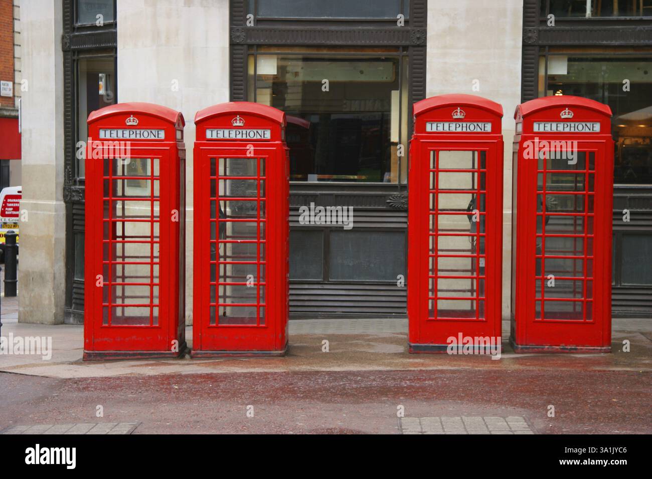 Four telephones booths in row at Lester Square in London, U.K. United ...