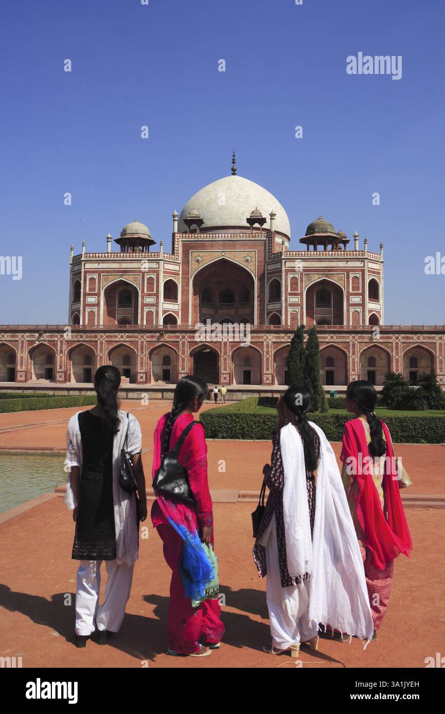 Indian girls watching Humayun's tomb built in 1570 made from red ...