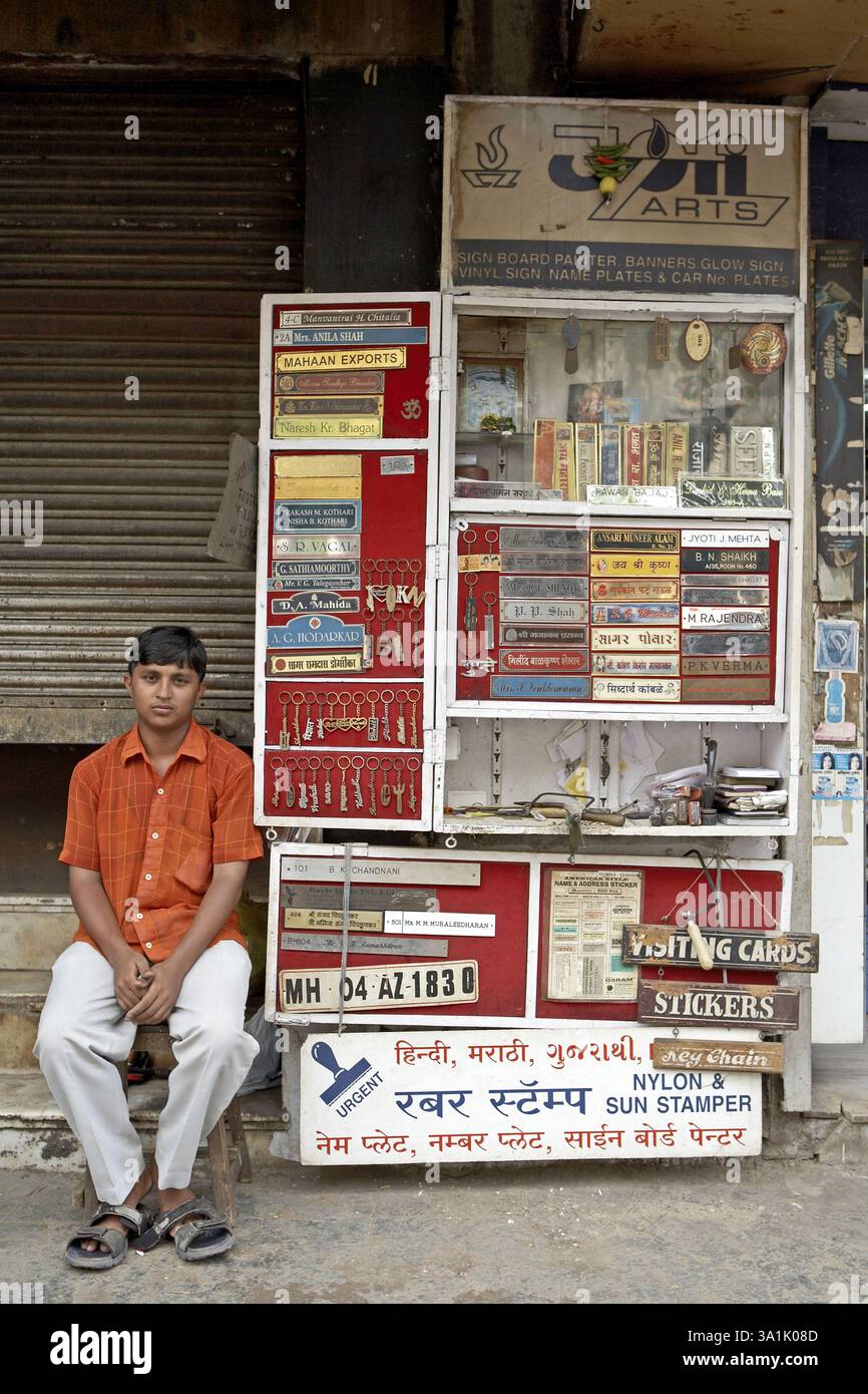 An engraved nameplate maker artist with a neat display of his creations ...