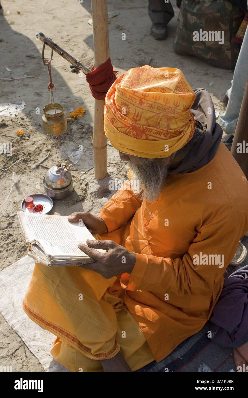 Saint reading holy book for worship in Kumbh mela, Allahabad, Uttar ...