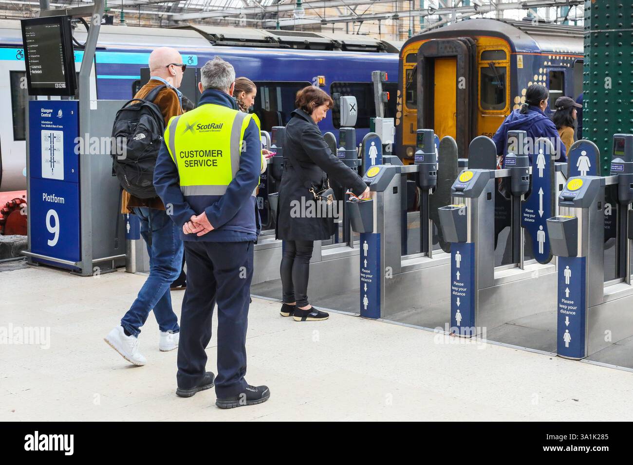 Passengers passing through ticket hi-res stock photography and images ...
