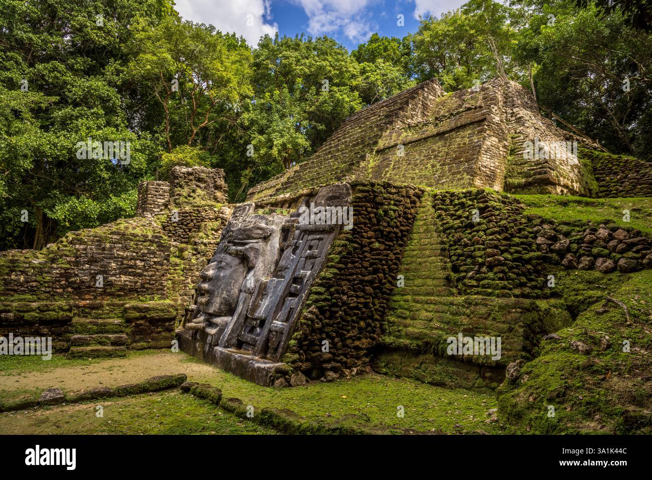 The Temple of the Mask at jungle ruins of the Lamanai Mayan ...