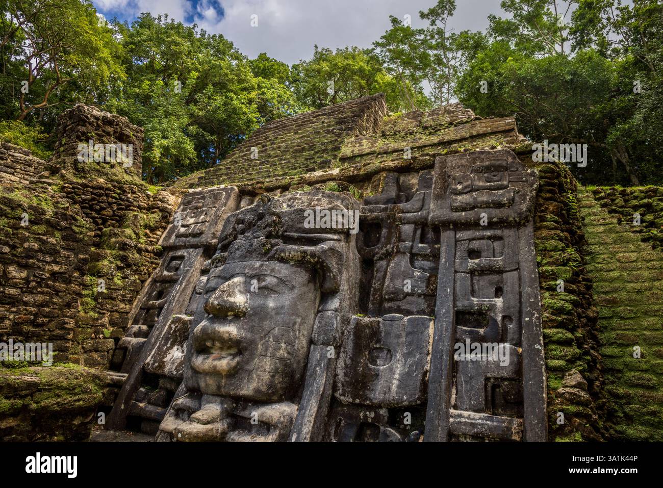 The Temple of the Mask at jungle ruins of the Lamanai Mayan ...