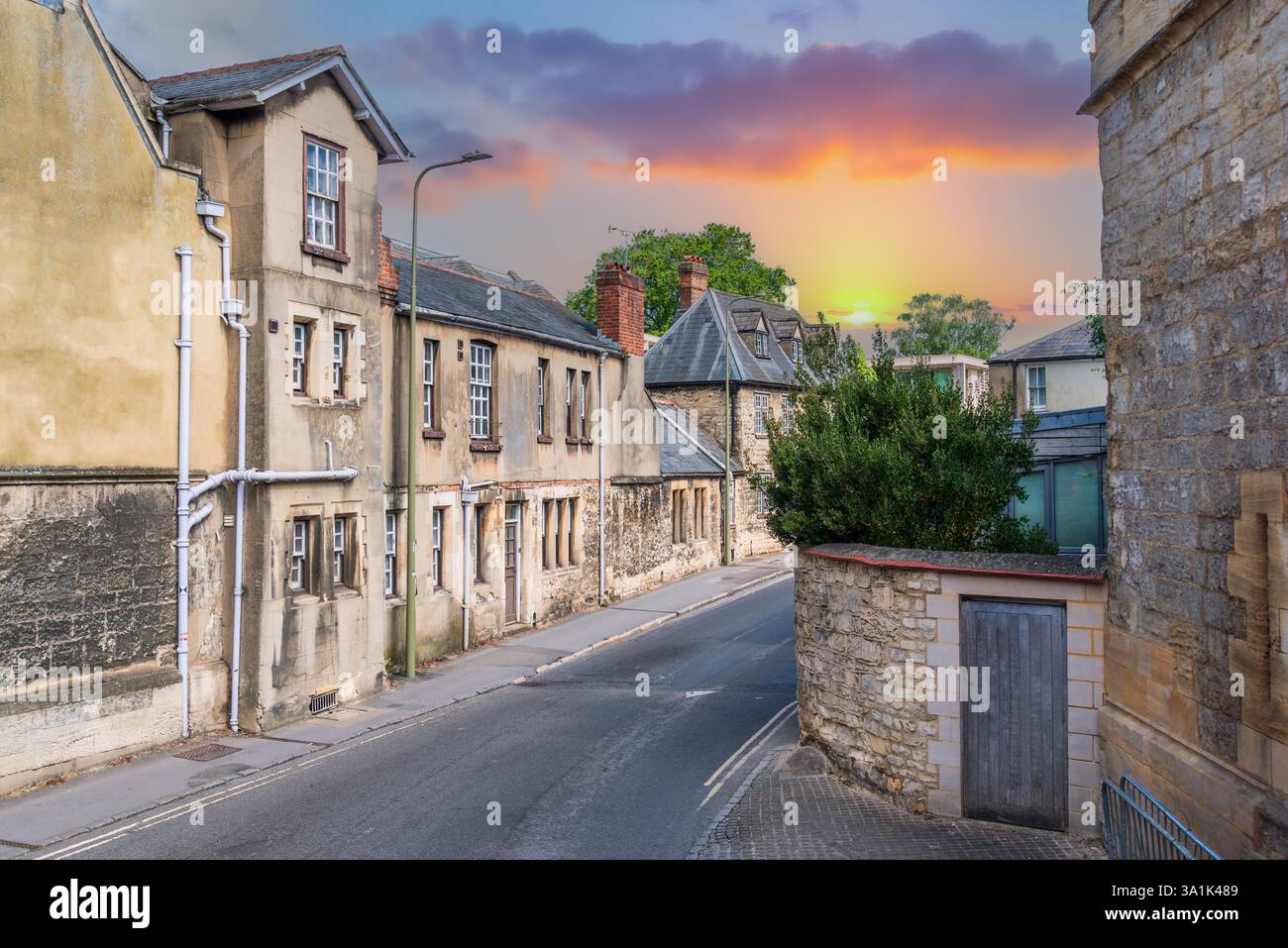 Charming Oxfordshire rustic street at sunset with traditional British ...