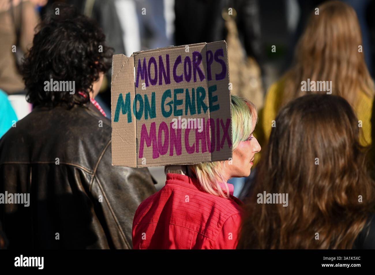 Paris, France. 08th Mar, 2025. A protester holds a placard - My body ...