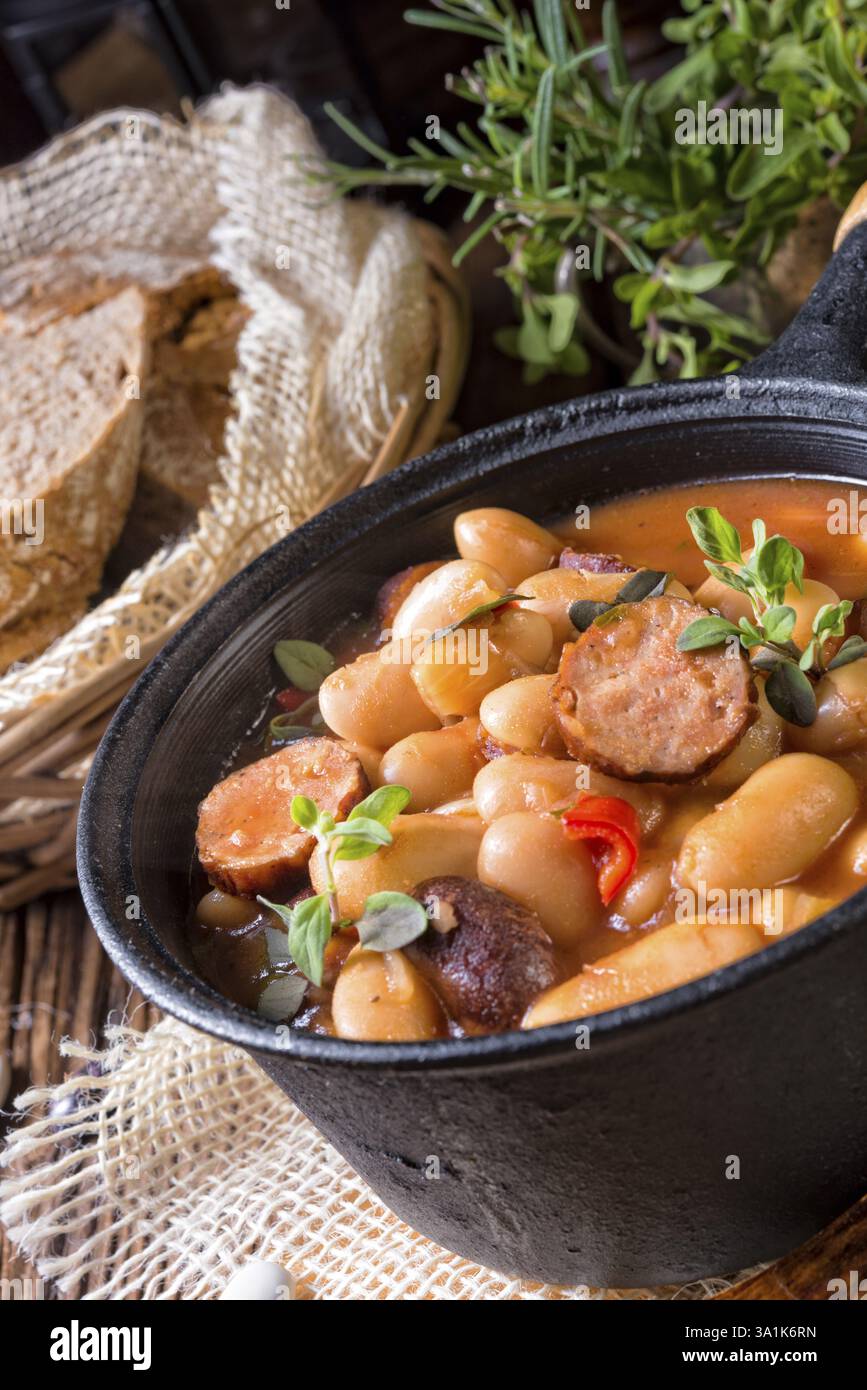 Polish baked beans with sausage Stock Photo - Alamy