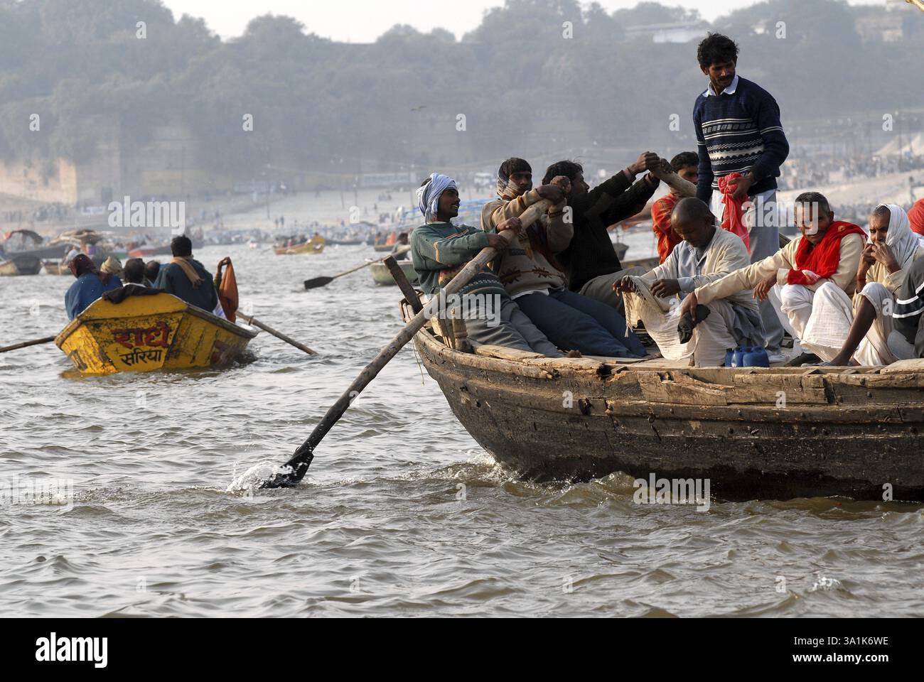 Boats ferry devotees at the confluence of the Ganges, Yamuna the ...