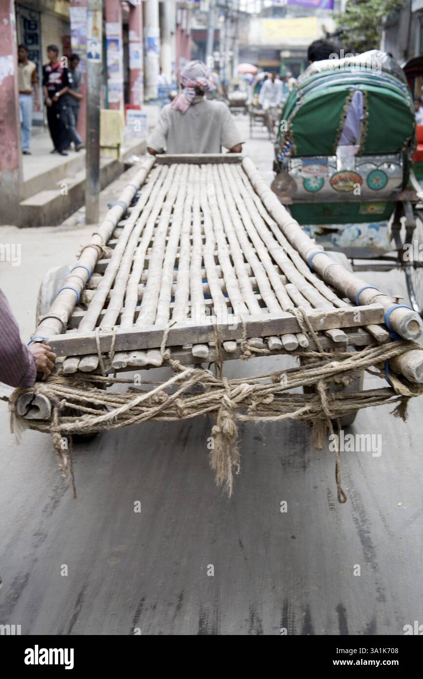 Bamboo cart pulled by man to carry luggage street scene in old Dhaka, Bangladesh, Asia Stock ...