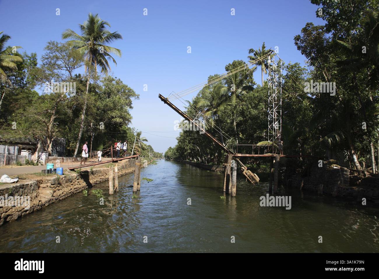 Mechanized, manual pedestrian bridge over backwaters lifted while ...