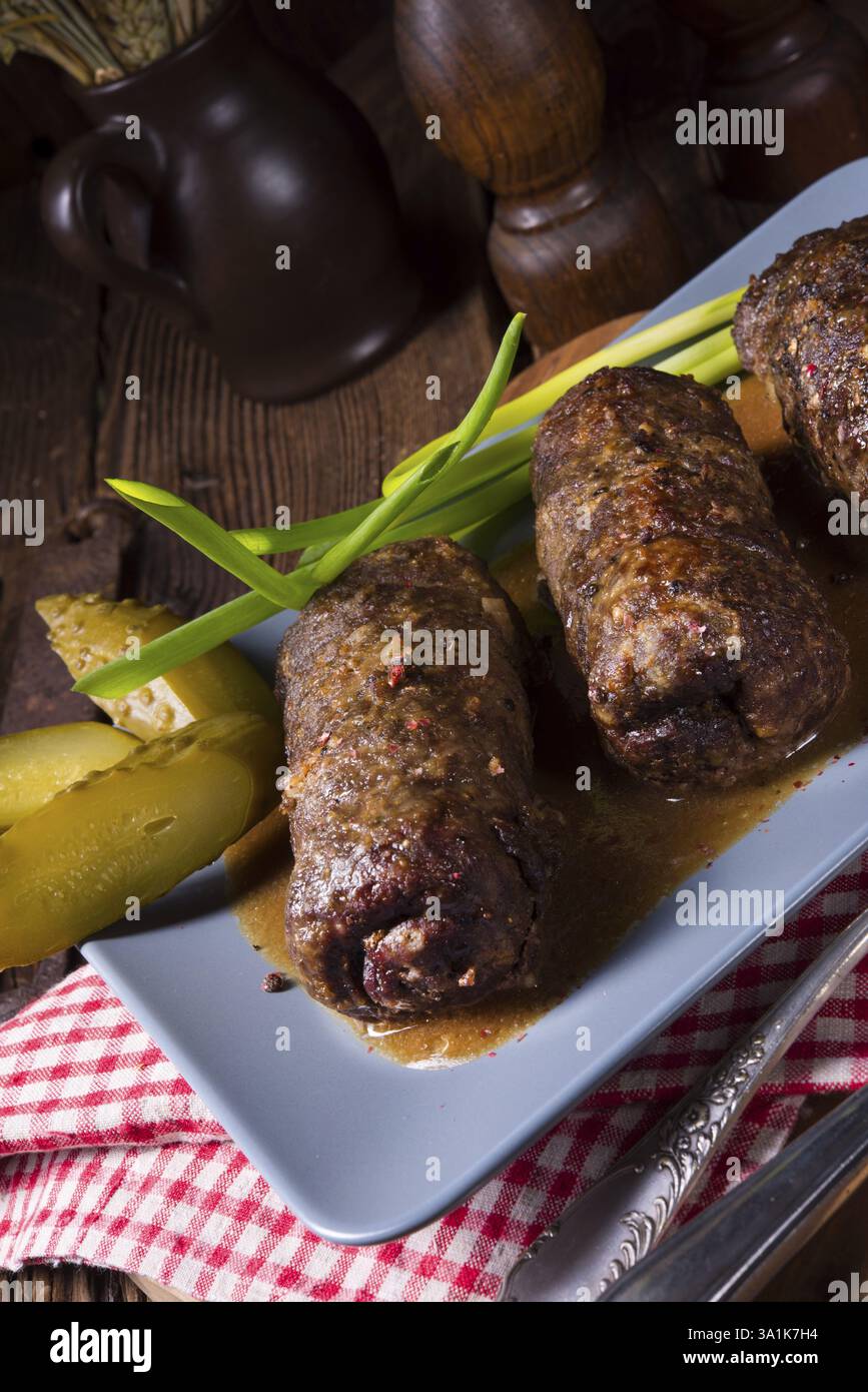 Baked beef roulades with delicious fillings Stock Photo - Alamy