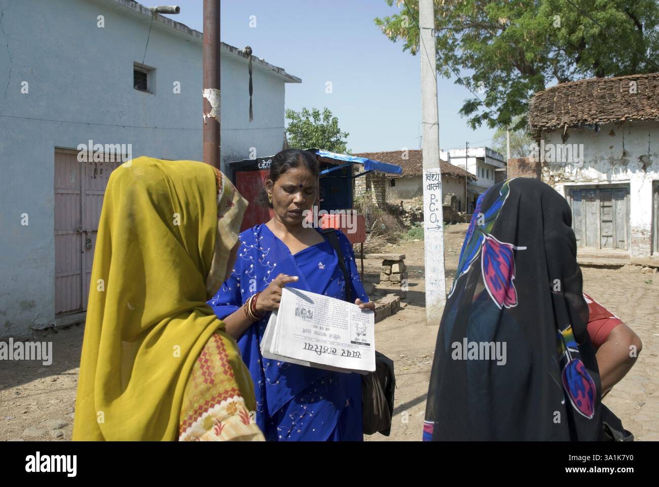 Woman reading newspaper, Uttar Pradesh, India, Asia Stock Photo - Alamy