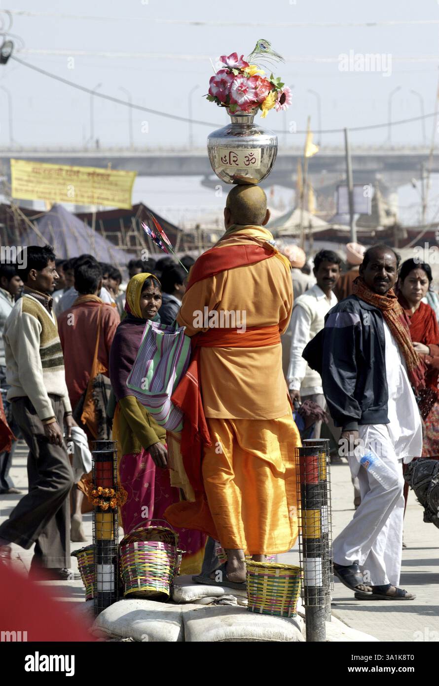 A saint, sadhu takes photographs of his fellow sadhus with a film ...