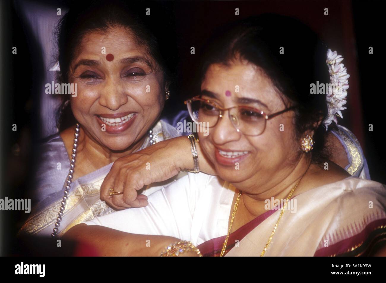 South Asian Indian singer Asha Bhonsle and her sister Usha Mangeshkar ...