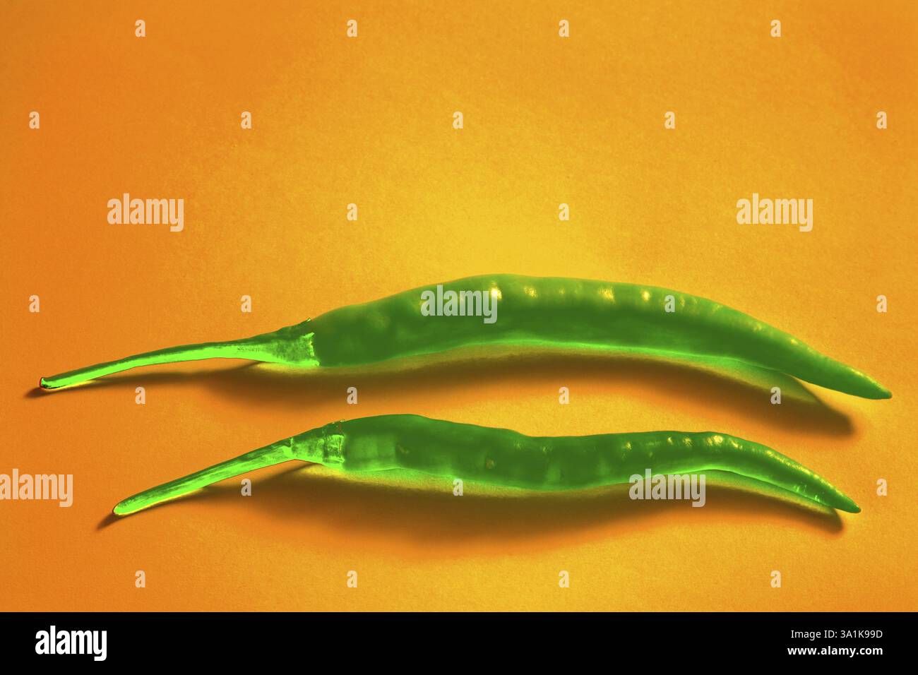 Concept, Indian spice green chillies hari mirch on orange background ...