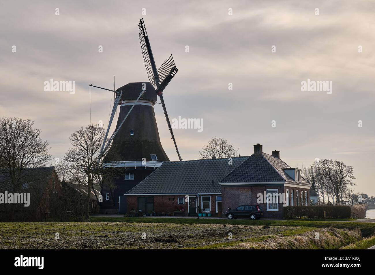 Historic hulling and grist mill De Hoop in Holwerd, Friesland, with ...