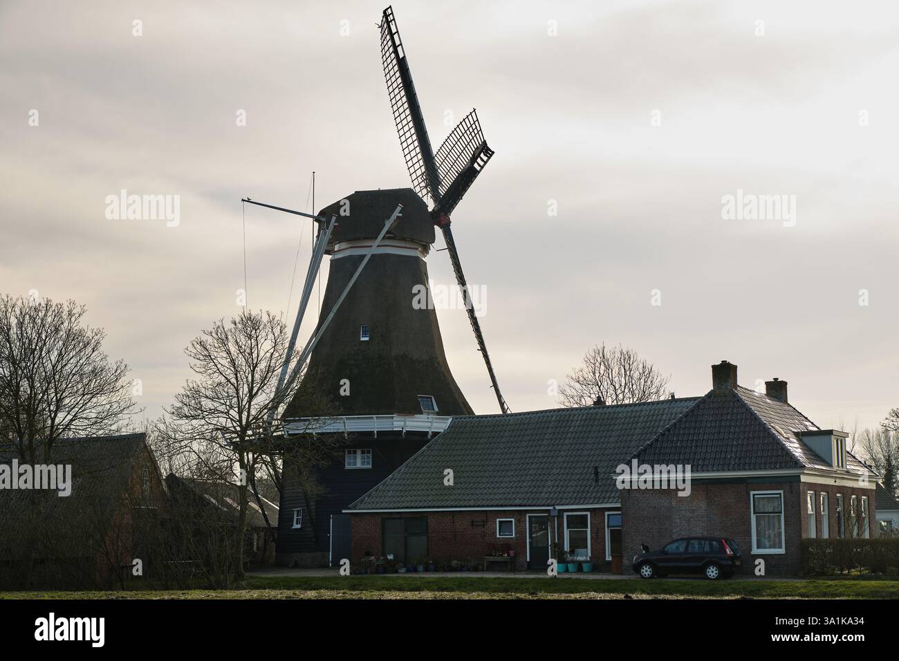 Historic hulling and grist mill De Hoop in Holwerd, Friesland, with ...