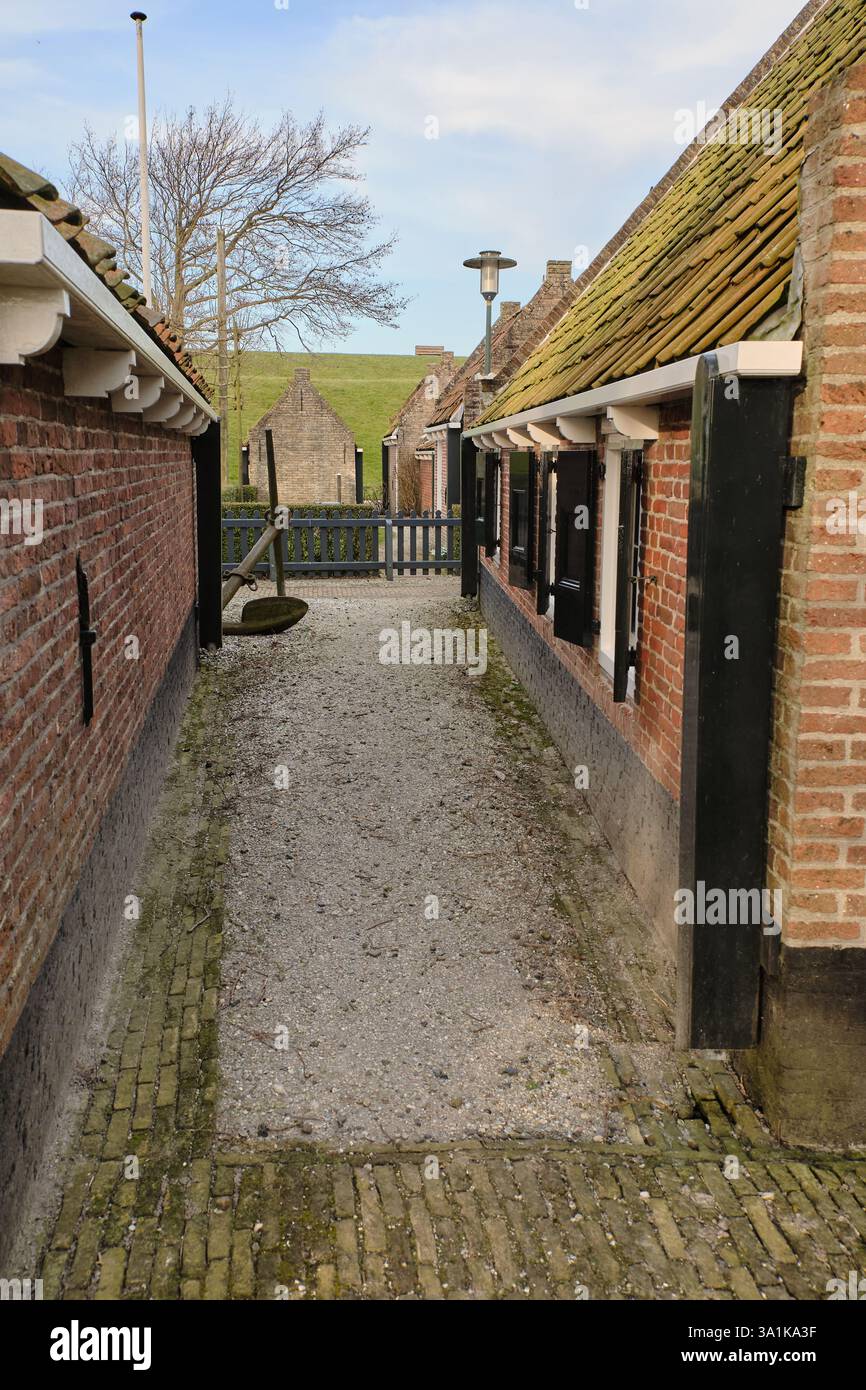 March 6, 2025 - Moddergat-Netherlands: Alley way with Traditional Dutch ...