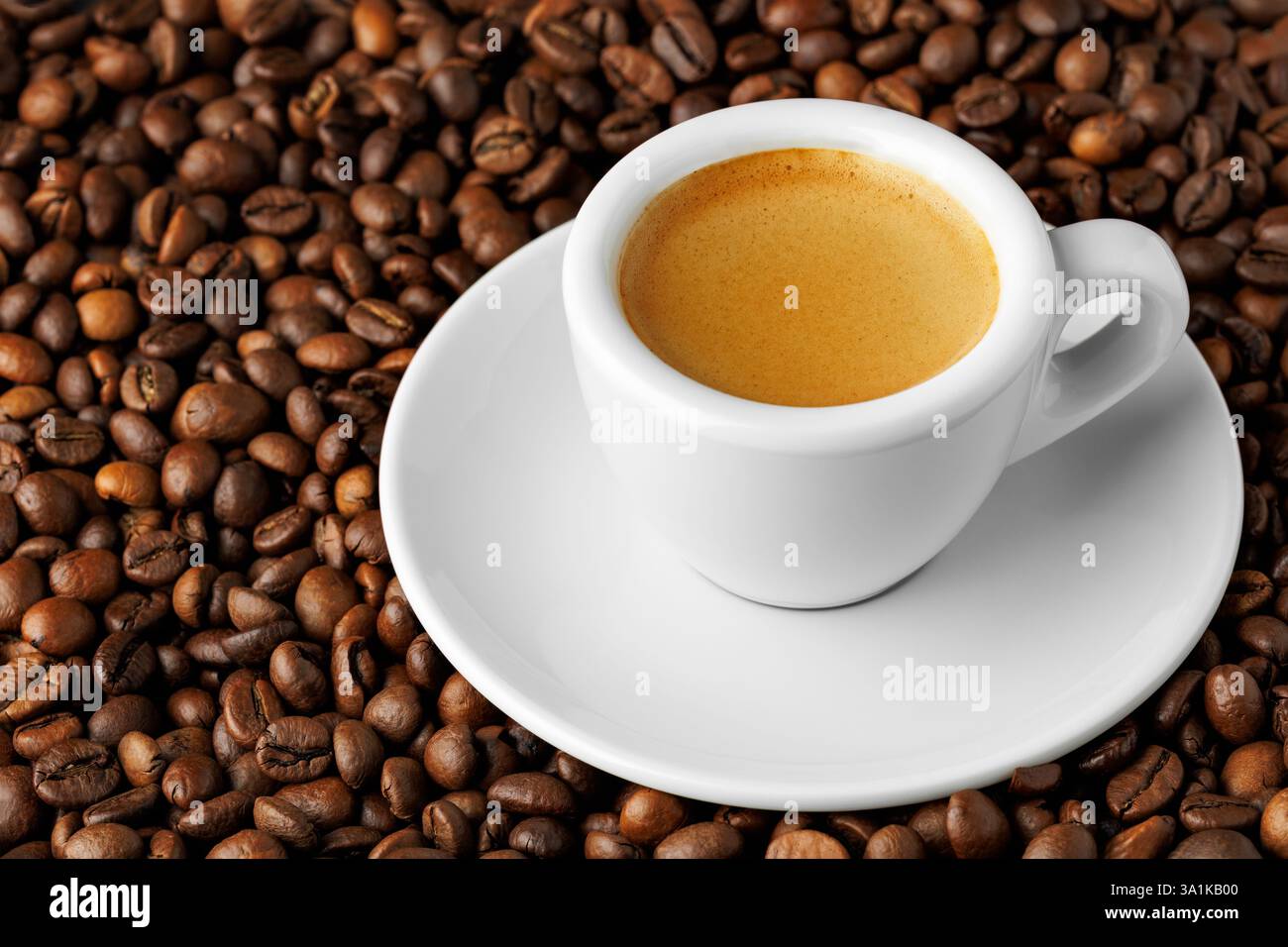 Small white espresso cup brimming with fresh, aromatic coffee resting ...