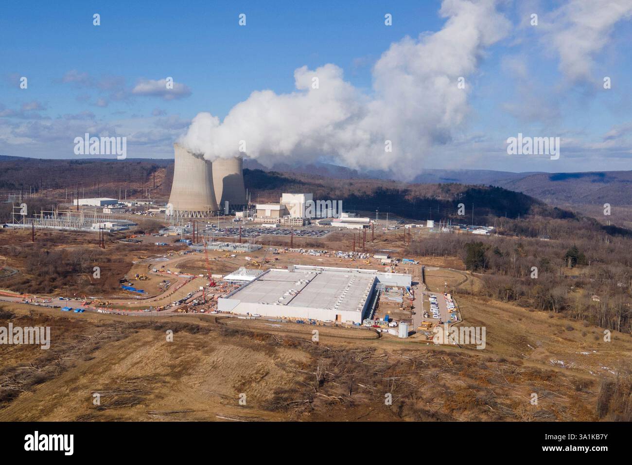 FILE - A data center owned by Amazon Web Services, front right, is ...