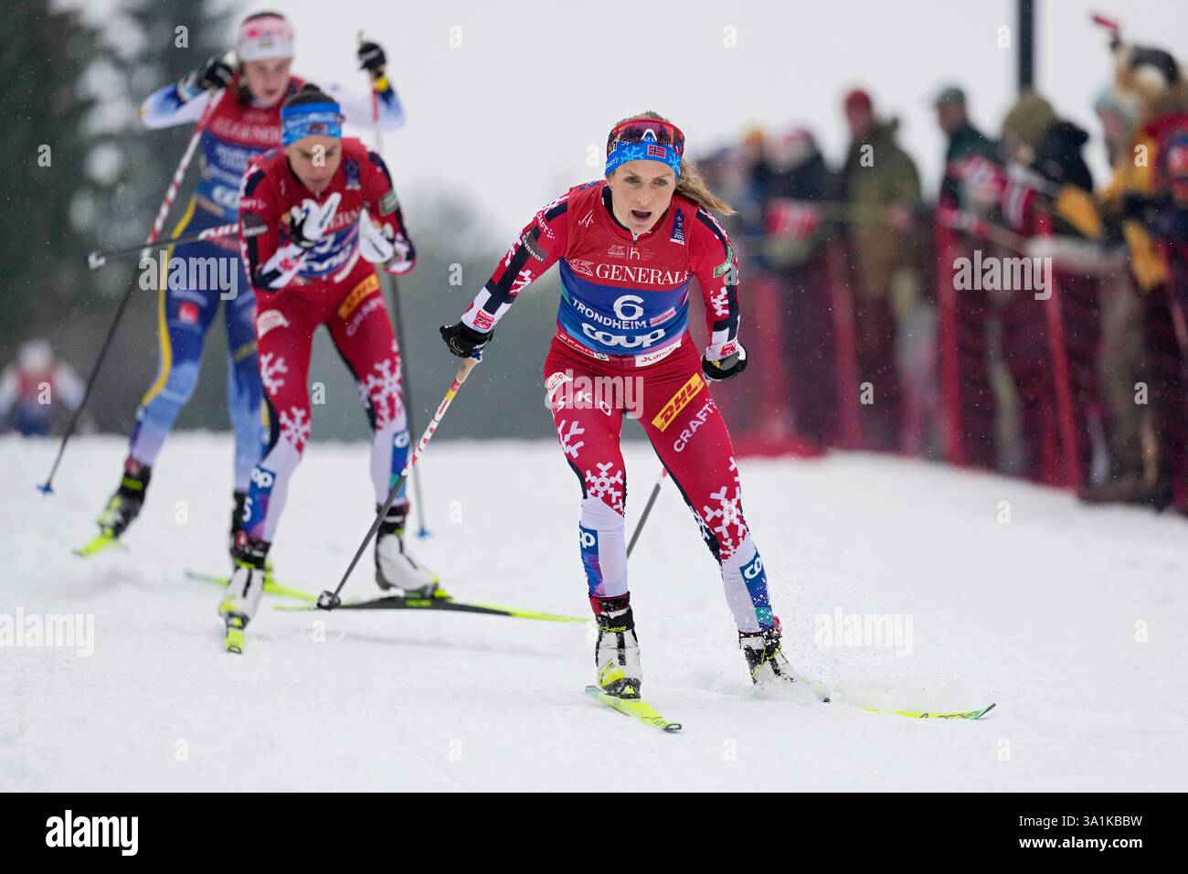 Therese Johaug, of Norway, leads Heidi Weng, of Norway, and Ebba ...